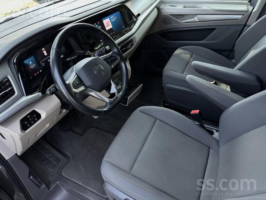 Grey Volkswagen Multivan 2023 in Riga, with an engine capacity of 2.00 L and mileage of 118 thousand km for 39950 €, photo 8 on AUTOMOTO.COM.LV