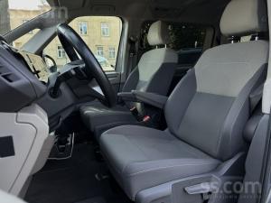 Grey Volkswagen Multivan 2023 in Riga, with an engine capacity of 2.00 L and mileage of 118 thousand km for 39950 €, photo 9 on AUTOMOTO.COM.LV