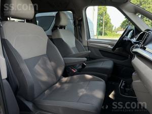 Grey Volkswagen Multivan 2023 in Riga, with an engine capacity of 2.00 L and mileage of 118 thousand km for 39950 €, photo 19 on AUTOMOTO.COM.LV