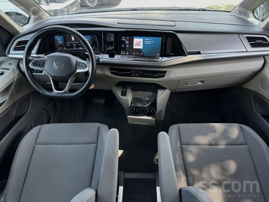 Grey Volkswagen Multivan 2023 in Riga, with an engine capacity of 2.00 L and mileage of 118 thousand km for 39950 €, photo 26 on AUTOMOTO.COM.LV