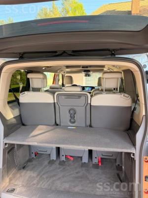 Orange Volkswagen Multivan 2022 in Riga, with an engine capacity of 1.40 L and mileage of 152 thousand km for 42500 €, photo 4 on AUTOMOTO.COM.LV