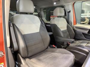 Orange Volkswagen Multivan 2022 in Riga, with an engine capacity of 2.00 L and mileage of 86 thousand km for 39700 €, photo 33 on AUTOMOTO.COM.LV
