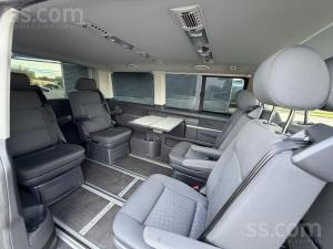 Red Volkswagen Multivan 2008 in Riga, with an engine capacity of 2.00 L and mileage of 227 thousand km for 8900 €, photo 15 on AUTOMOTO.COM.LV
