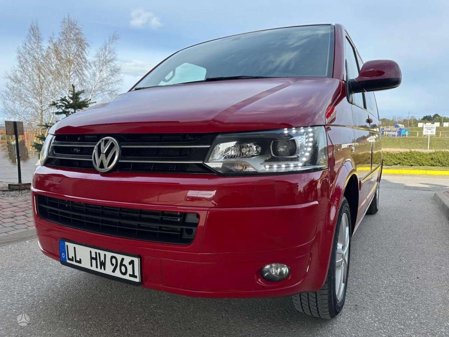 Red Volkswagen Multivan 2013 in Vilnius, with an engine capacity of 1.97 L and mileage of 297 thousand km for 13900 €, photo 1 on AUTOMOTO.COM.LV