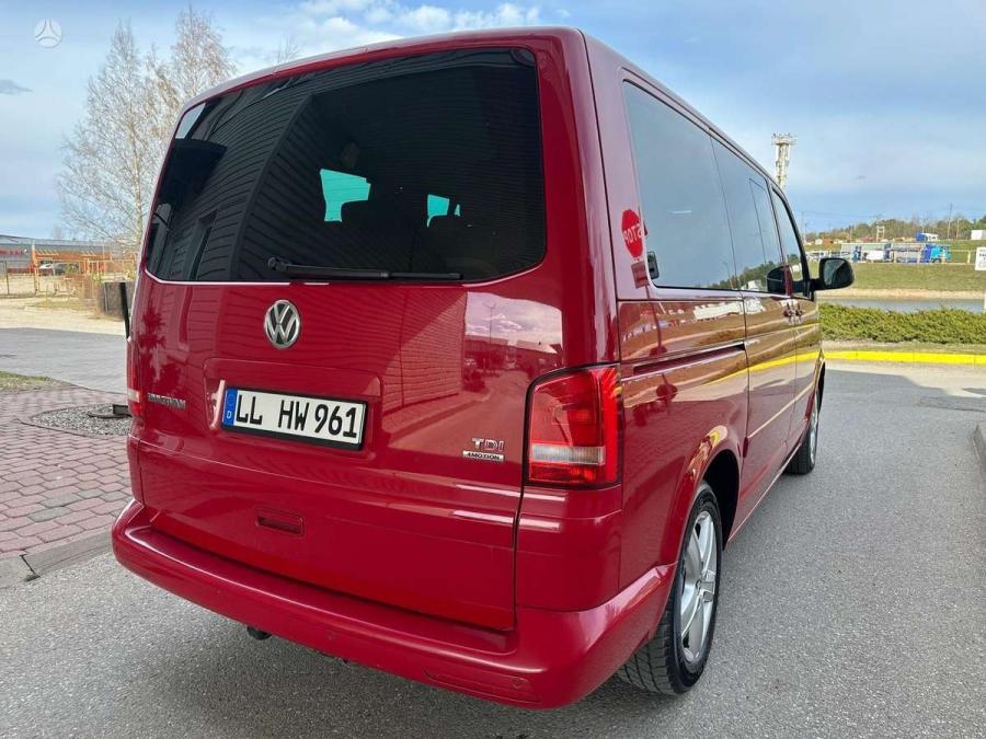 Red Volkswagen Multivan 2013 in Vilnius, with an engine capacity of 1.97 L and mileage of 297 thousand km for 13900 €, photo 9 on AUTOMOTO.COM.LV