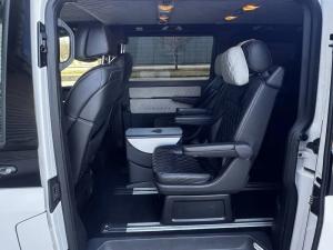 White Volkswagen Multivan 2015 in Riga, with an engine capacity of 2.00 L and mileage of 210 thousand km for 19500 €, photo 13 on AUTOMOTO.COM.LV