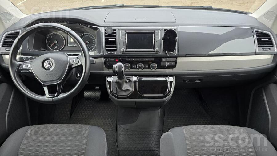 White Volkswagen Multivan 2018 in Riga, with an engine capacity of 2.00 L and mileage of 216 thousand km for 27000 €, photo 6 on AUTOMOTO.COM.LV