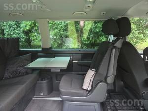 White Volkswagen Multivan 2018 in Riga, with an engine capacity of 2.00 L and mileage of 216 thousand km for 27000 €, photo 10 on AUTOMOTO.COM.LV