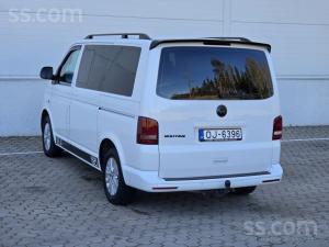 White Volkswagen Multivan 2013 in Riga, with an engine capacity of 2.00 L and mileage of 231 thousand km for 16990 €, photo 13 on AUTOMOTO.COM.LV