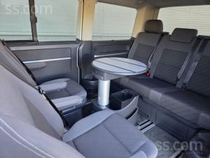 White Volkswagen Multivan 2013 in Riga, with an engine capacity of 2.00 L and mileage of 231 thousand km for 16990 €, photo 26 on AUTOMOTO.COM.LV