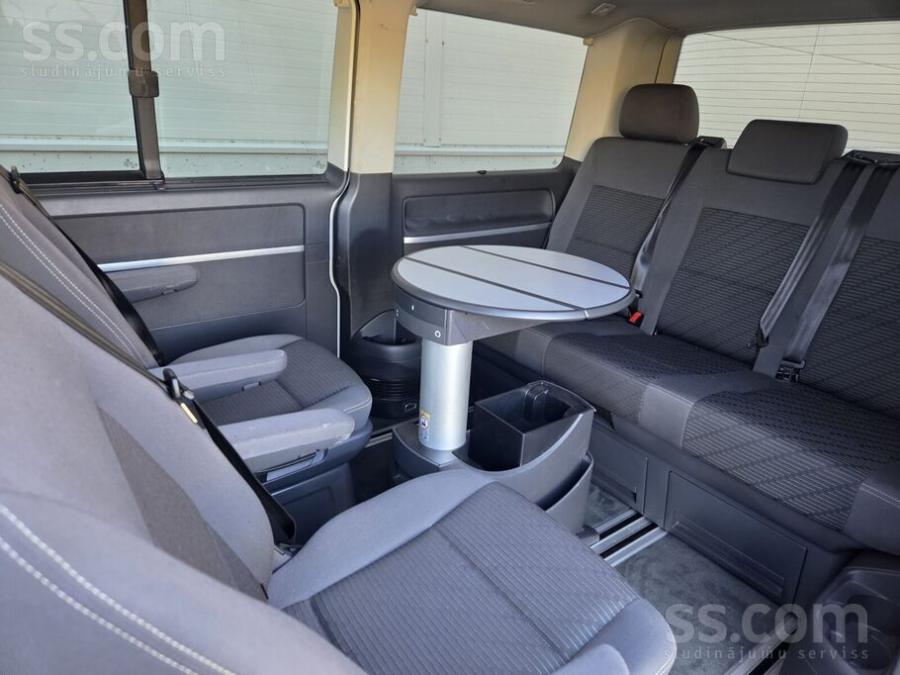 White Volkswagen Multivan 2013 in Riga, with an engine capacity of 2.00 L and mileage of 231 thousand km for 16990 €, photo 26 on AUTOMOTO.COM.LV