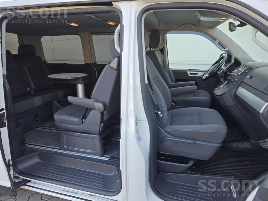 White Volkswagen Multivan 2013 in Riga, with an engine capacity of 2.00 L and mileage of 231 thousand km for 16990 €, photo 32 on AUTOMOTO.COM.LV