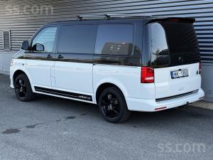 White Volkswagen Multivan 2015 in Riga, with an engine capacity of 2.00 L and mileage of 210 thousand km for 19500 €, photo 4 on AUTOMOTO.COM.LV
