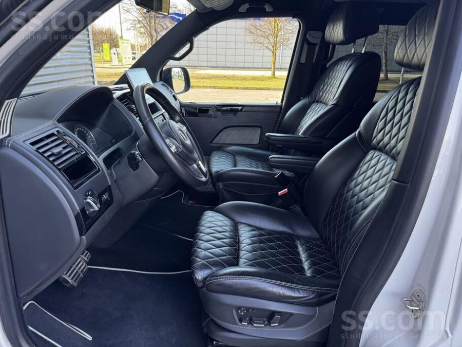 White Volkswagen Multivan 2015 in Riga, with an engine capacity of 2.00 L and mileage of 210 thousand km for 19500 €, photo 10 on AUTOMOTO.COM.LV