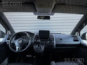White Volkswagen Multivan 2015 in Riga, with an engine capacity of 2.00 L and mileage of 210 thousand km for 19500 €, photo 19 on AUTOMOTO.COM.LV