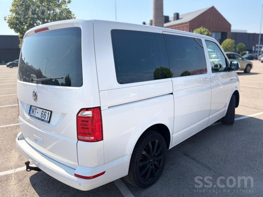 White Volkswagen Multivan 2018 in Riga, with an engine capacity of 2.00 L and mileage of 218 thousand km for 26950 €, photo 3 on AUTOMOTO.COM.LV
