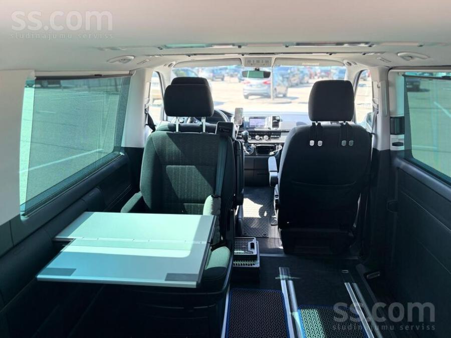 White Volkswagen Multivan 2018 in Riga, with an engine capacity of 2.00 L and mileage of 218 thousand km for 26950 €, photo 13 on AUTOMOTO.COM.LV