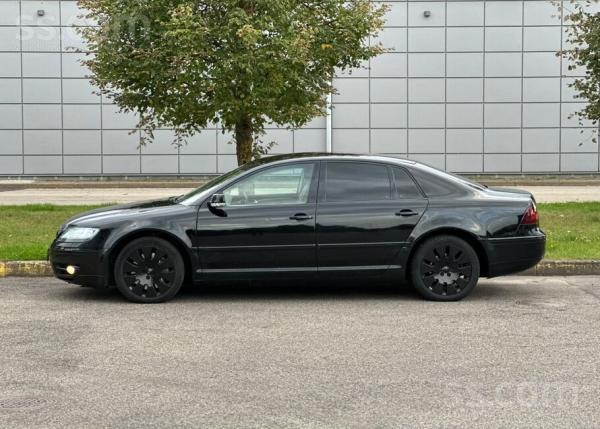 Black Volkswagen Phaeton 2005 in Riga, with an engine capacity of 3.00 L and mileage of 291 thousand km for 2890 €, photo 7 on AUTOMOTO.COM.LV