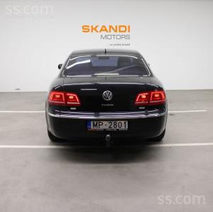 Black Volkswagen Phaeton 2011 in Riga, with an engine capacity of 3.00 L and mileage of 299 thousand km for 5790 €, photo 5 on AUTOMOTO.COM.LV