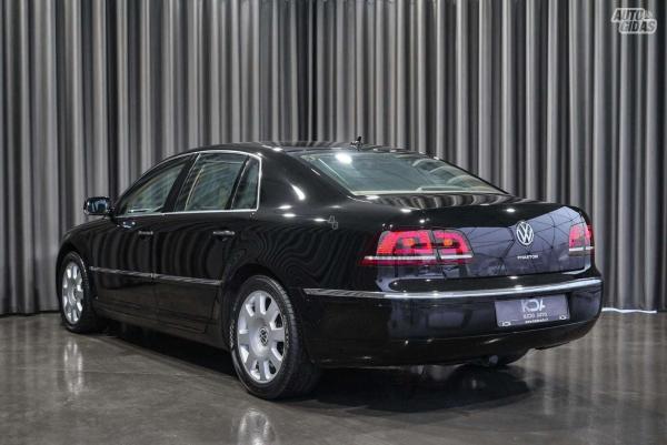Black Volkswagen Phaeton 2013 in Marijampole, with an engine capacity of 3.00 L and mileage of 246 thousand km for 7950 €, photo 8 on AUTOMOTO.COM.LV