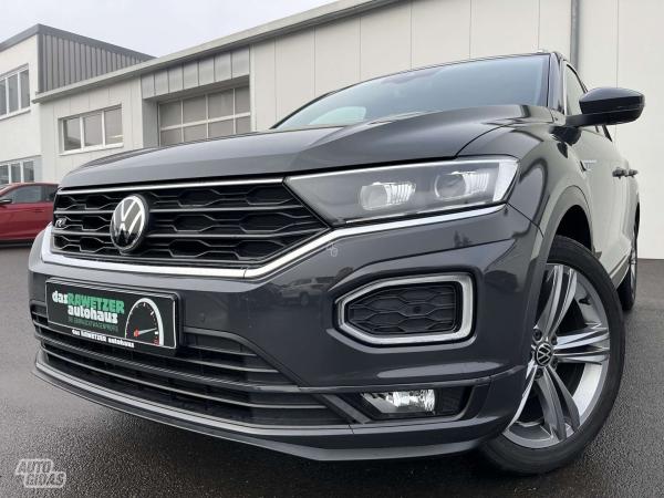 Grey Volkswagen T-Roc 2021 in Kaunas, with an engine capacity of 1.50 L and mileage of 28 thousand km for 25346 €, photo 1 on AUTOMOTO.COM.LV