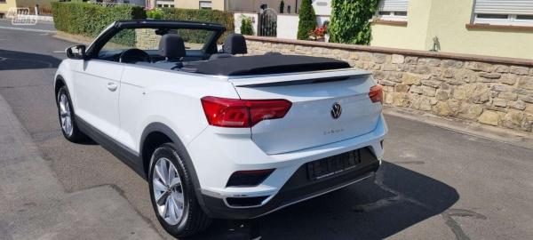 White Volkswagen T-Roc 2021 in Kaunas, with an engine capacity of 1.50 L and mileage of 28 thousand km for 25480 €, photo 3 on AUTOMOTO.COM.LV