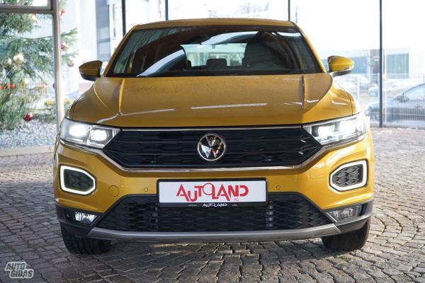 Yellow Volkswagen T-Roc 2021 in Kaunas, with an engine capacity of 1.00 L and mileage of 22 thousand km for 23935 €, photo 7 on AUTOMOTO.COM.LV