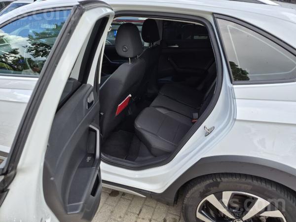 White Volkswagen Taigo 2023 in Riga, with an engine capacity of 1.00 L and mileage of 64 thousand km for 17300 €, photo 8 on AUTOMOTO.COM.LV