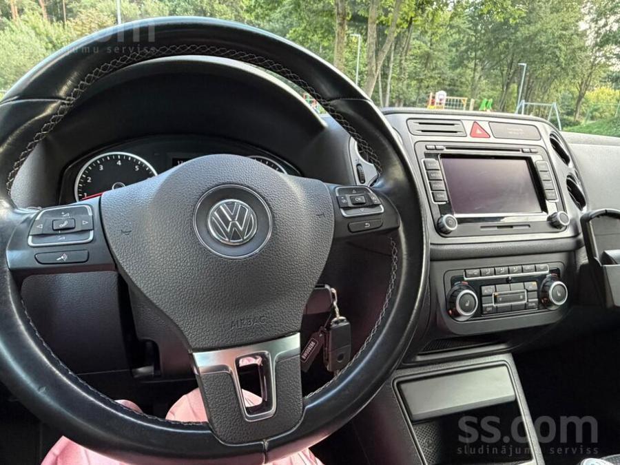 Black Volkswagen Tiguan 2011 in Riga, with an engine capacity of 1.40 L and mileage of 171 thousand km for 6350 €, photo 14 on AUTOMOTO.COM.LV
