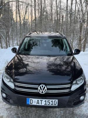 Black Volkswagen Tiguan 2013 in Utena, with an engine capacity of 1.97 L and mileage of 270 thousand km for 10950 €, photo 25 on AUTOMOTO.COM.LV
