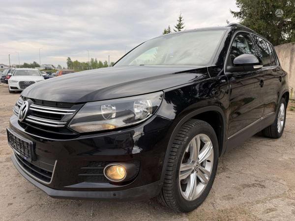 Black Volkswagen Tiguan 2014 in Utena, with an engine capacity of 2.00 L and mileage of 278 thousand km for 9350 €, photo 1 on AUTOMOTO.COM.LV