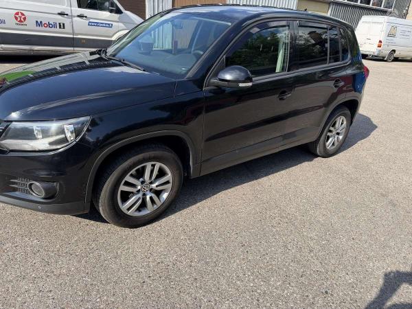 Black Volkswagen Tiguan 2014 in Vilnius, with an engine capacity of 1.98 L and mileage of 191 thousand km for 8790 €, photo 2 on AUTOMOTO.COM.LV