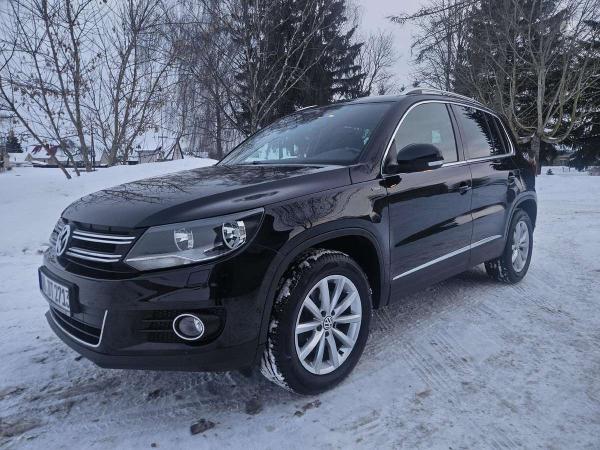 Black Volkswagen Tiguan 2015 in Radviliskis, with an engine capacity of 1.97 L and mileage of 210 thousand km for 9990 €, photo 1 on AUTOMOTO.COM.LV