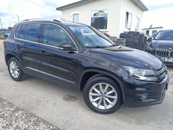 Black Volkswagen Tiguan 2015 in Vilnius, with an engine capacity of 1.39 L and mileage of 126 thousand km for 9970 €, photo 1 on AUTOMOTO.COM.LV