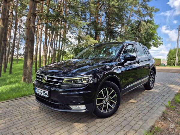 Black Volkswagen Tiguan 2016 in Utena, with an engine capacity of 1.97 L and mileage of 284 thousand km for 14990 €, photo 1 on AUTOMOTO.COM.LV