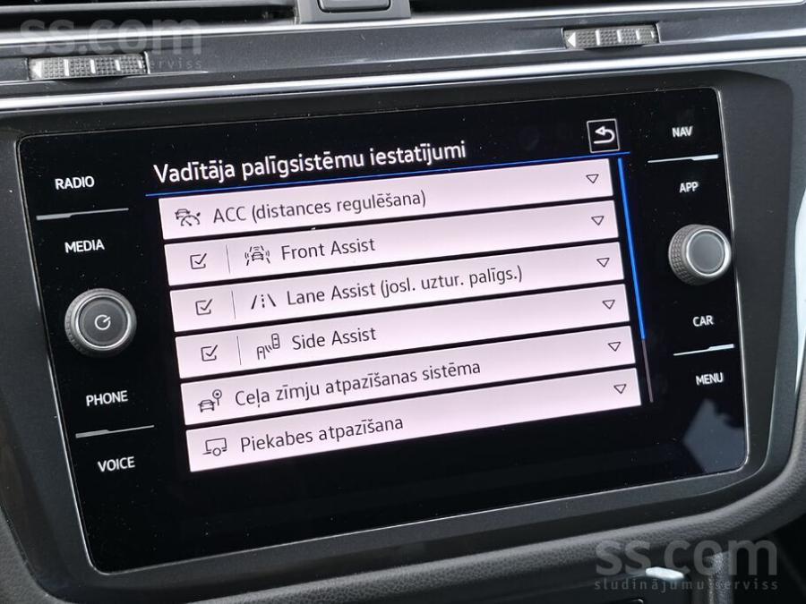 Black Volkswagen Tiguan 2022 in Riga, with an engine capacity of 1.40 L and mileage of 77 thousand km for 27950 €, photo 26 on AUTOMOTO.COM.LV