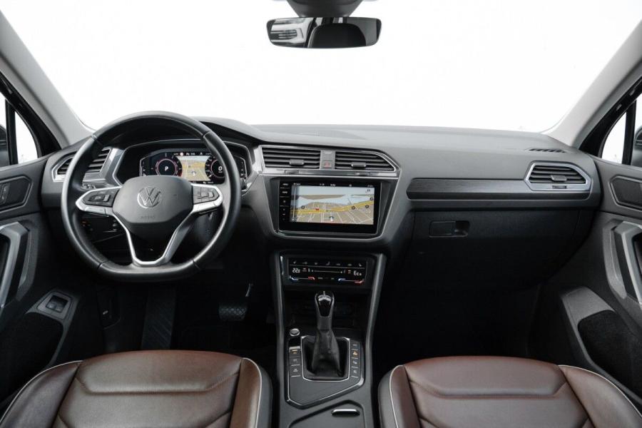 Black Volkswagen Tiguan 2022 in Riga, with an engine capacity of 1.40 L and mileage of 134 thousand km for 24500 €, photo 39 on AUTOMOTO.COM.LV