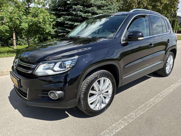Black Volkswagen Tiguan 2014 in Kaunas, with an engine capacity of 2.00 L and mileage of 286 thousand km for 11200 €, photo 7 on AUTOMOTO.COM.LV