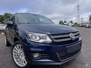 Blue Volkswagen Tiguan 2012 in Alytus, with an engine capacity of 1.39 L and mileage of 218 thousand km for 7850 €, photo  on AUTOMOTO.COM.LV