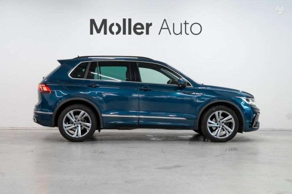 Blue Volkswagen Tiguan 2021 in Vilnius, with an engine capacity of 1.50 L and mileage of 99 thousand km for 25300 €, photo 4 on AUTOMOTO.COM.LV