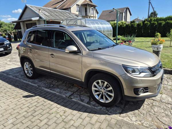 Brown Volkswagen Tiguan 2012 in Marijampole, with an engine capacity of 1.97 L and mileage of 162 thousand km for 8700 €, photo 1 on AUTOMOTO.COM.LV