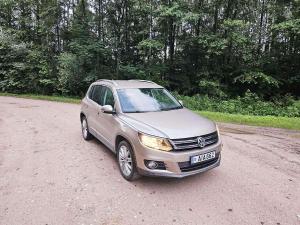 Brown Volkswagen Tiguan 2012 in Kaunas, with an engine capacity of 1.39 L and mileage of 187 thousand km for 5200 €, photo 3 on AUTOMOTO.COM.LV