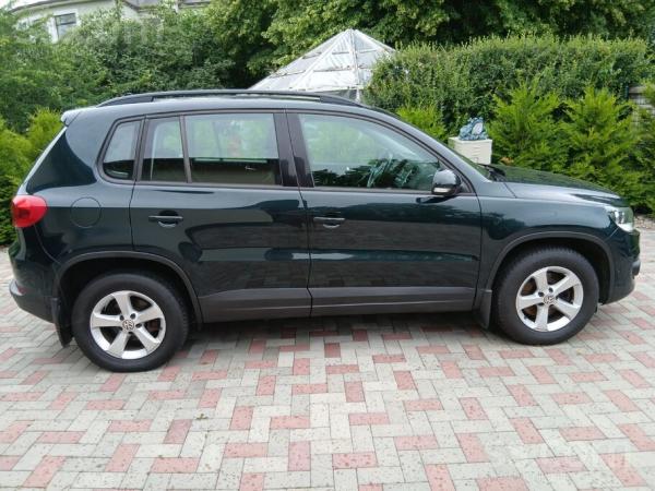 Green Volkswagen Tiguan 2013 in Jurmala, with an engine capacity of 2.00 L and mileage of 262 thousand km for 7995 €, photo 4 on AUTOMOTO.COM.LV