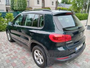 Green Volkswagen Tiguan 2013 in Jurmala, with an engine capacity of 2.00 L and mileage of 262 thousand km for 7995 €, photo 9 on AUTOMOTO.COM.LV
