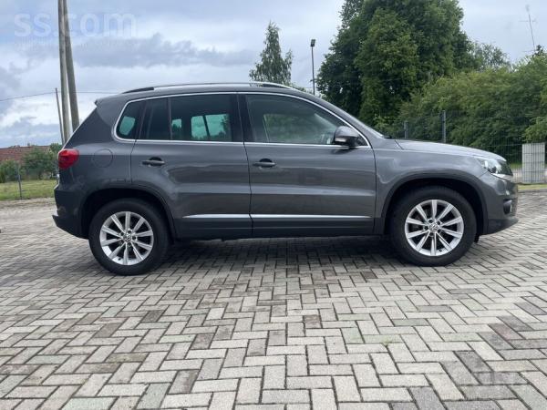 Grey Volkswagen Tiguan 2012 in Ogre, with an engine capacity of 2.00 L and mileage of 238 thousand km for 9970 €, photo 5 on AUTOMOTO.COM.LV