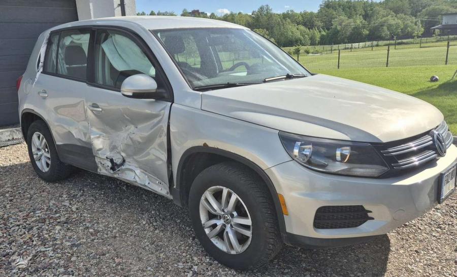 Grey Volkswagen Tiguan 2013 in Marijampole, with an engine capacity of 1.98 L and mileage of 230 thousand km for 3200 €, photo 5 on AUTOMOTO.COM.LV