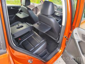 Orange Volkswagen Tiguan 2010 in Riga, with an engine capacity of 1.40 L and mileage of 251 thousand km for 4800 €, photo 12 on AUTOMOTO.COM.LV
