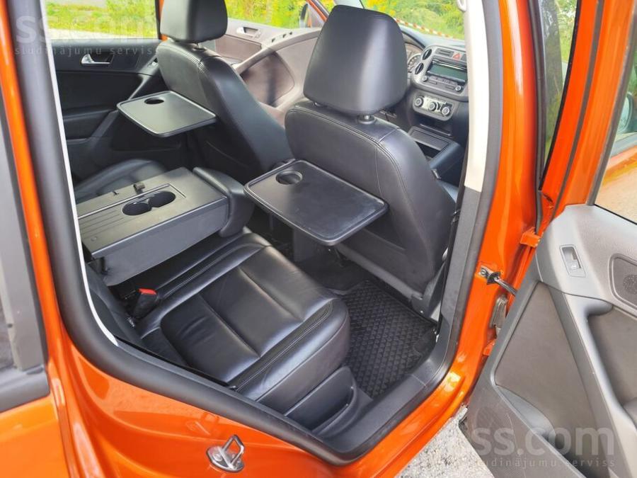 Orange Volkswagen Tiguan 2010 in Riga, with an engine capacity of 1.40 L and mileage of 251 thousand km for 4800 €, photo 12 on AUTOMOTO.COM.LV