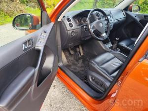 Orange Volkswagen Tiguan 2010 in Riga, with an engine capacity of 1.40 L and mileage of 251 thousand km for 4800 €, photo 14 on AUTOMOTO.COM.LV