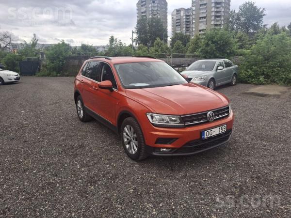 Orange Volkswagen Tiguan 2017 in Riga, with an engine capacity of 1.40 L and mileage of 146 thousand km for 18990 €, photo 2 on AUTOMOTO.COM.LV